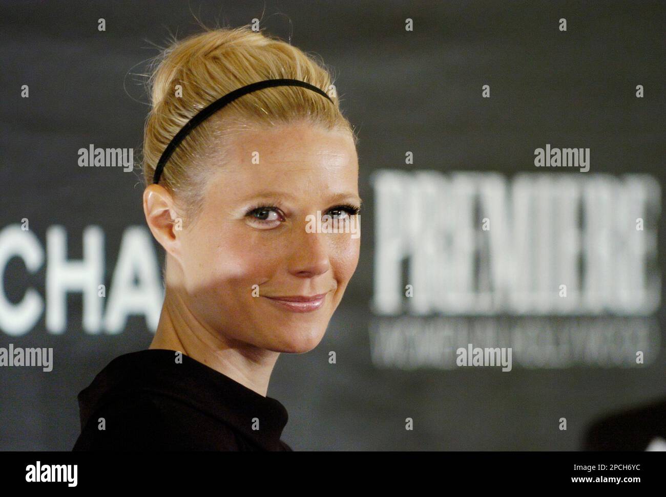 Actress Gwyneth Paltrow turns back for photographers upon arriving at ...