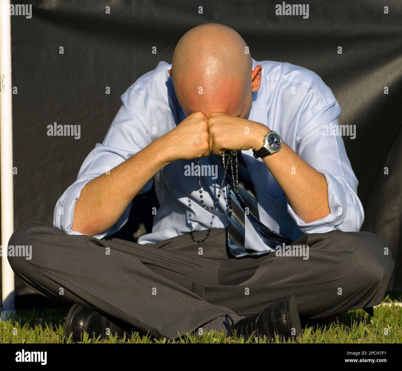 Sean O'Dell from Ormond Beach, Fla. prays across the street from the ...