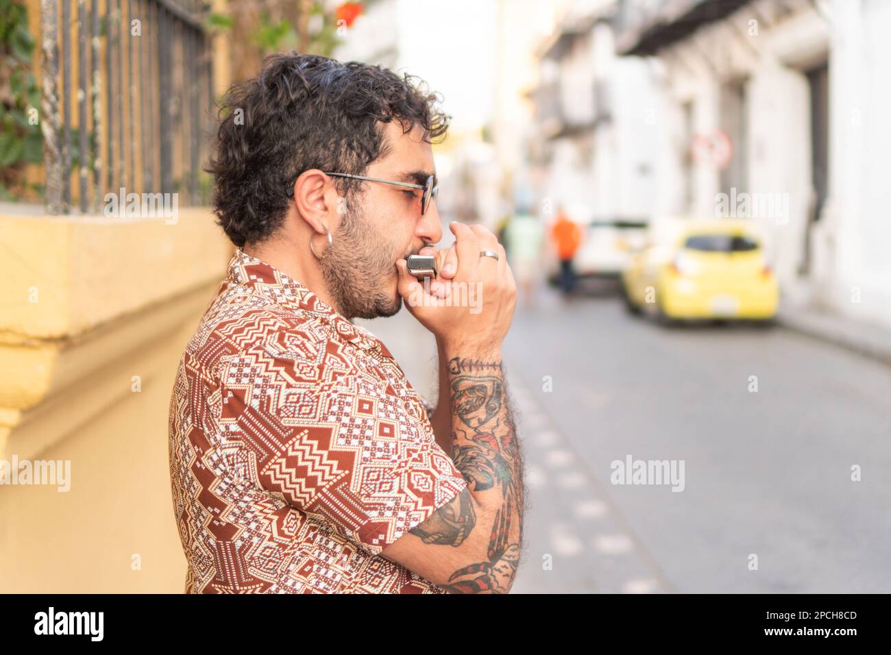 Portrait man playing harmonica hi-res stock photography and images - Alamy