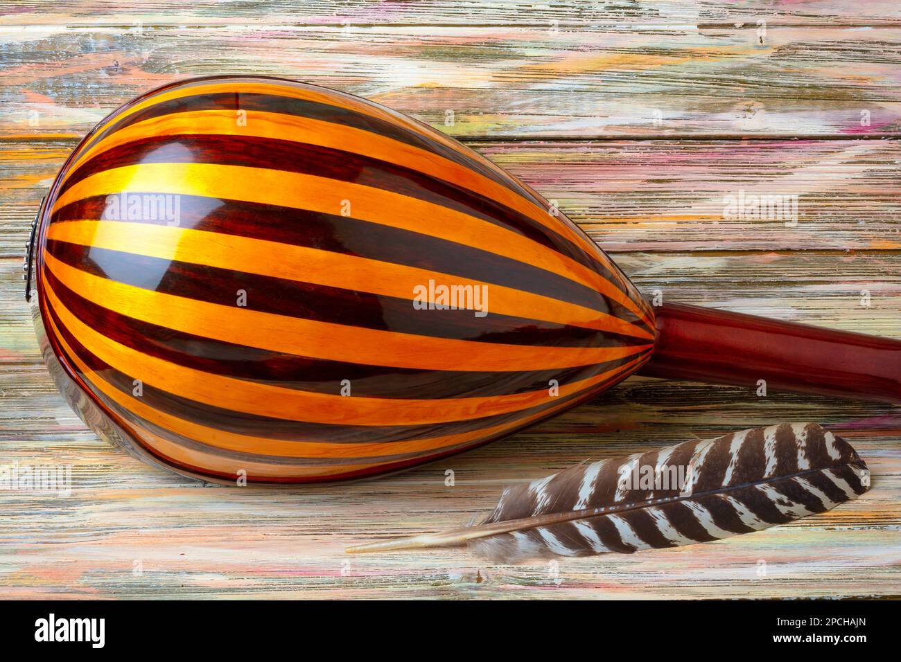 Mandolin And Feather Still Life Stock Photo - Alamy