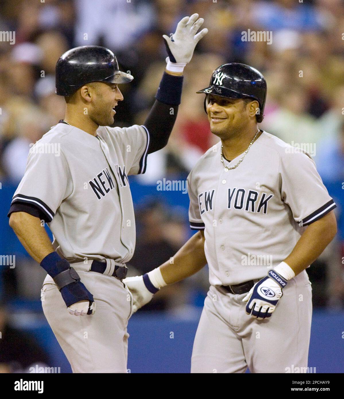 New York Yankees' Derek Jeter, left, congratulates Bobby Abreu after ...