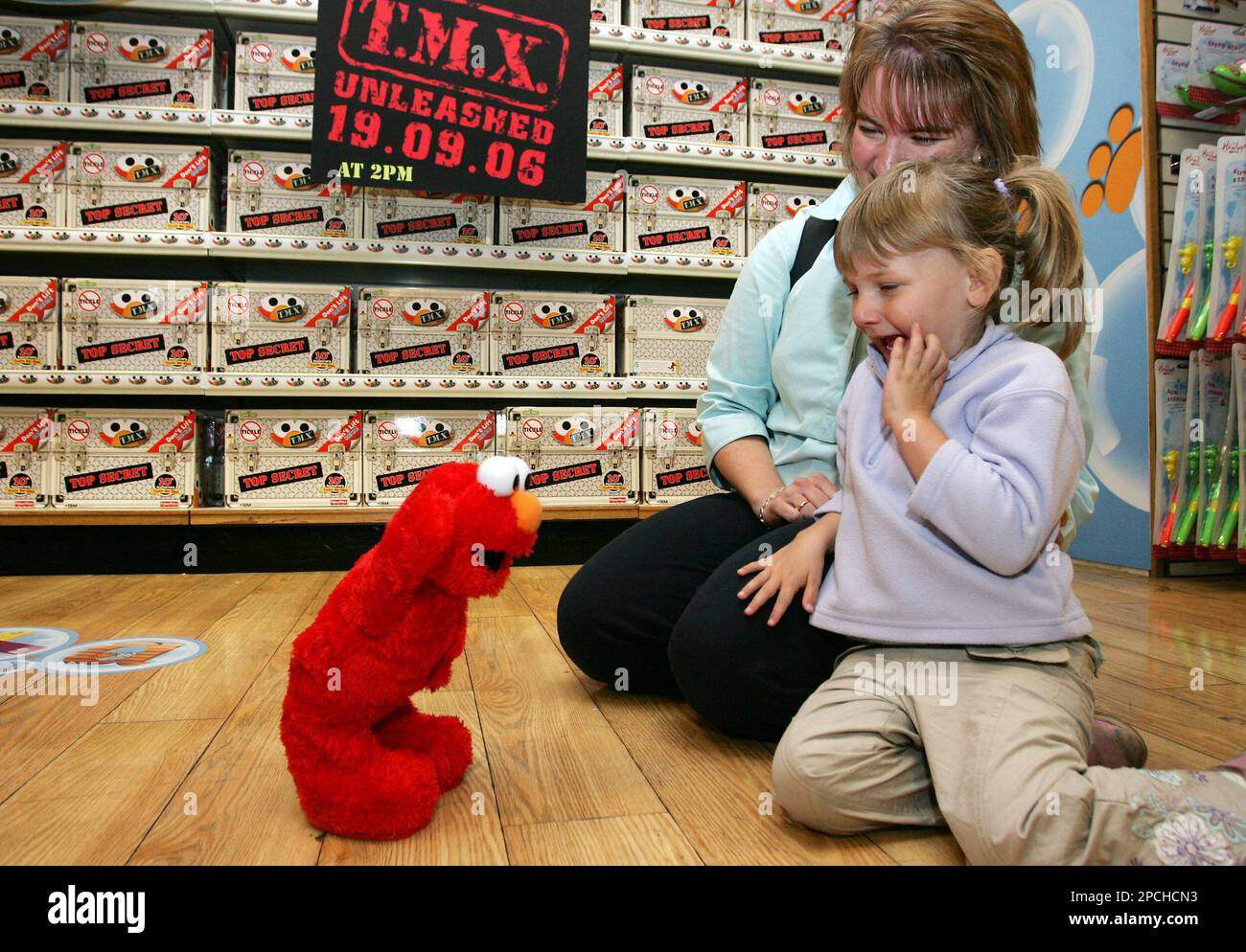 A child reacts to a TMX Elmo being demonstrated as it is unveiled at ...