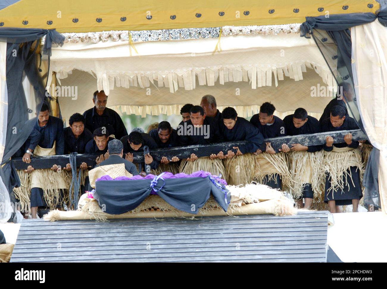The casket bearing King Taufa'ahau Tupou is lowered to his final ...