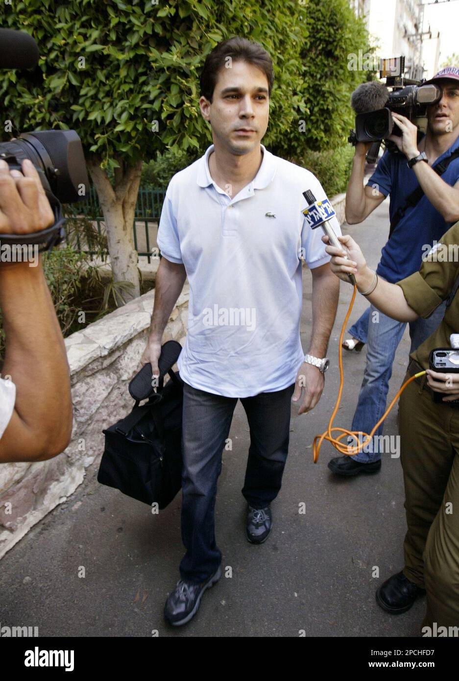 ** FILE ** Israeli Golan Cipel is followed by reporters as he arrives ...