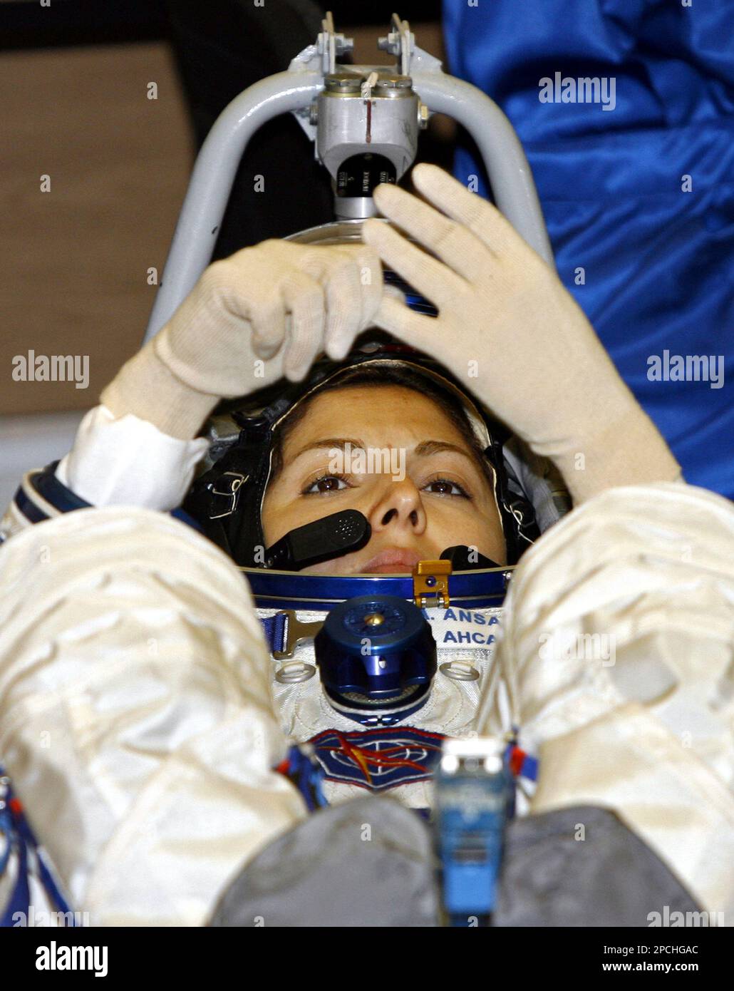U.S. entrepreneur Anousheh Ansari prepares to check her suit before the ...
