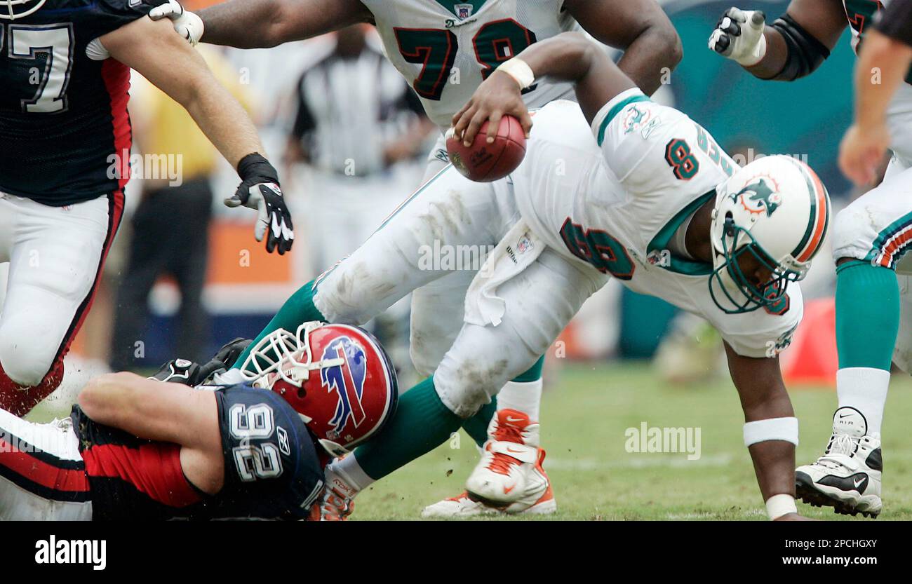 Buffalo Bills' Ryan Denney sacks Miami Dolphins quarterback Daunte ...