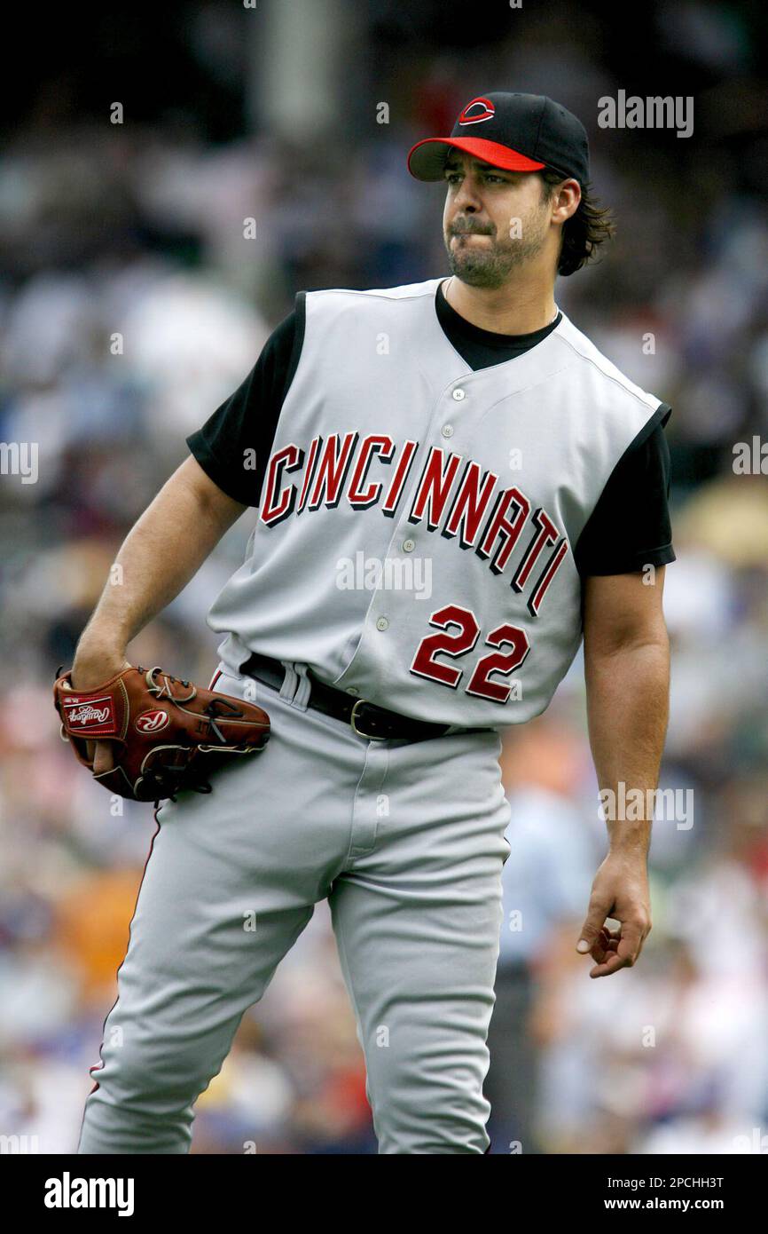 Cincinnati Reds pitcher Eric Milton watches Chicago Cubs' Henry Blanco ...