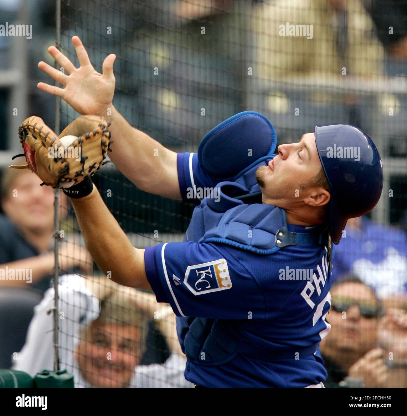 Kansas City Royals catcher Paul Phillips catches a pop fly hit by ...
