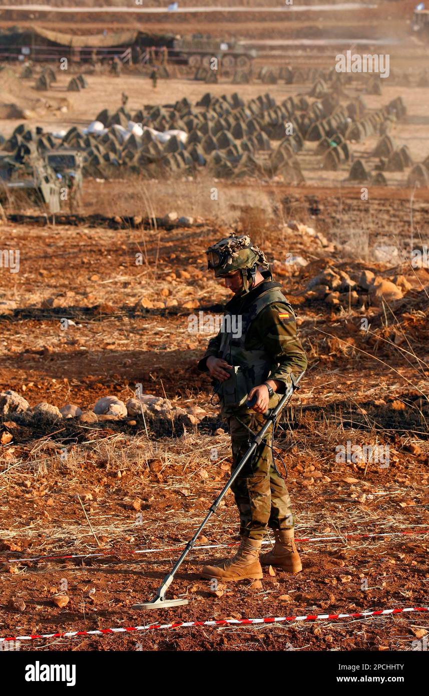 A Spanish U.N. peacekeeper specialising in explosives uses a metal ...