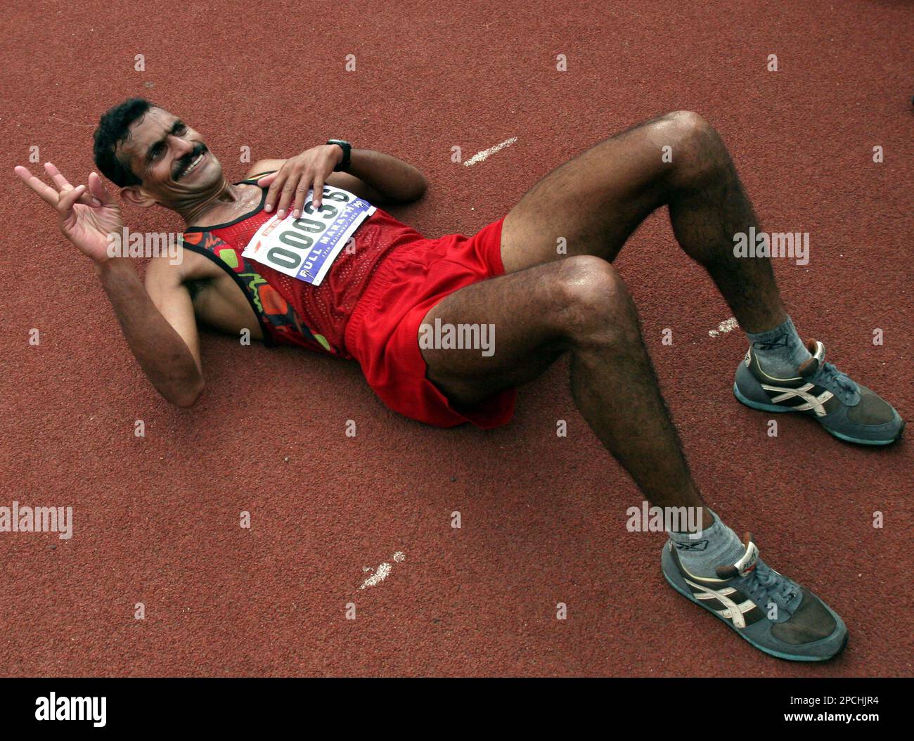 Bangalore International Marathon winner H. A. Chinnappa of India ...