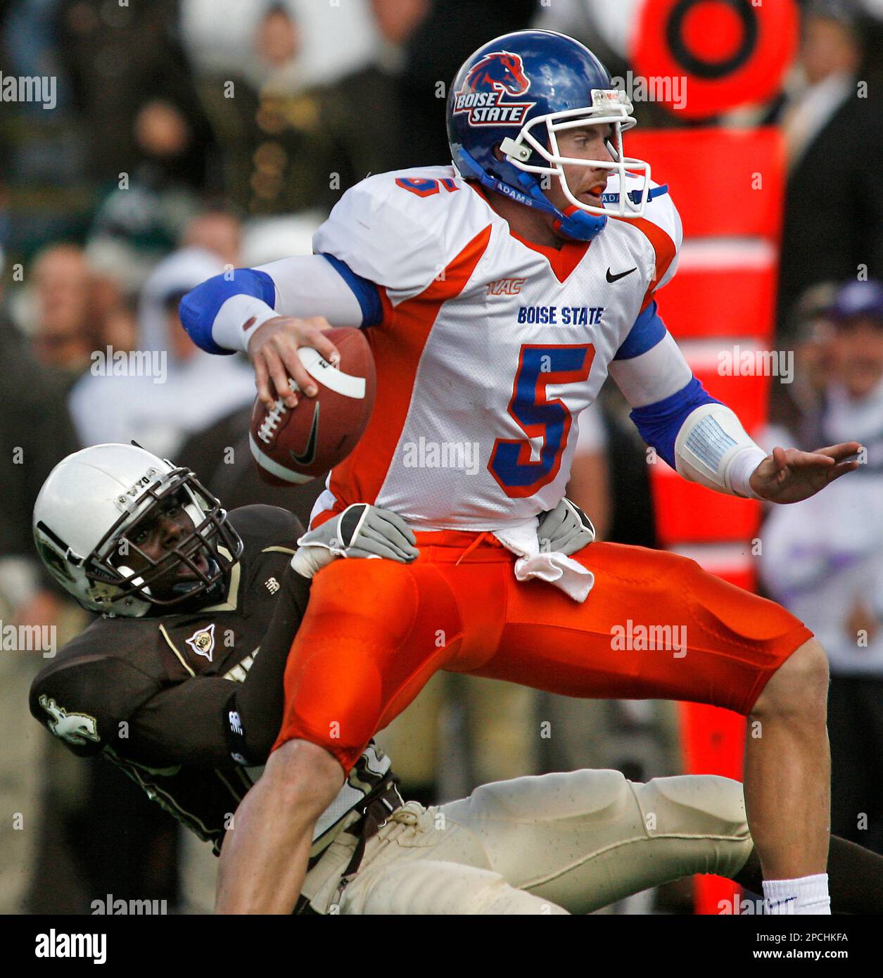Wyoming's Julius Stinson (20) sacks Boise State University quarterback ...