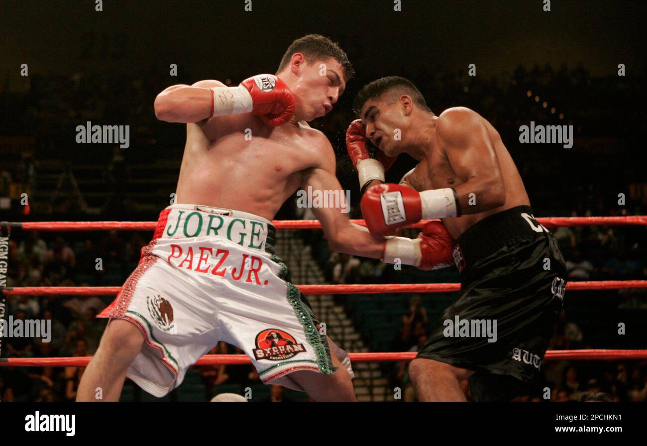 Jorge Paez Jr., left, of Mexico, connects with a punch to the body of ...