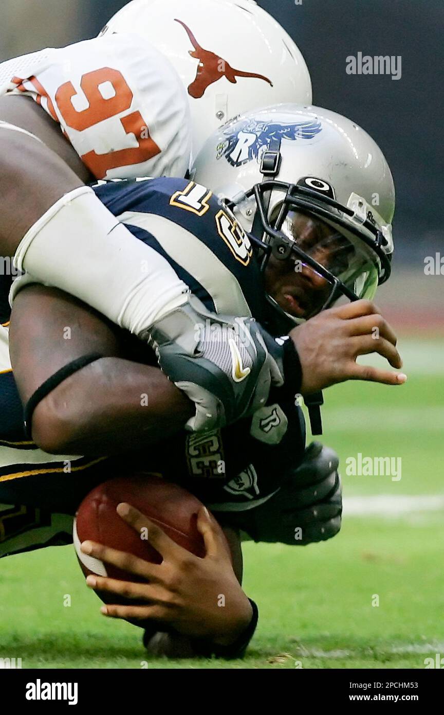 Texas defensive tackle Frank Okam (97) sacks Rice quarterback Joel ...