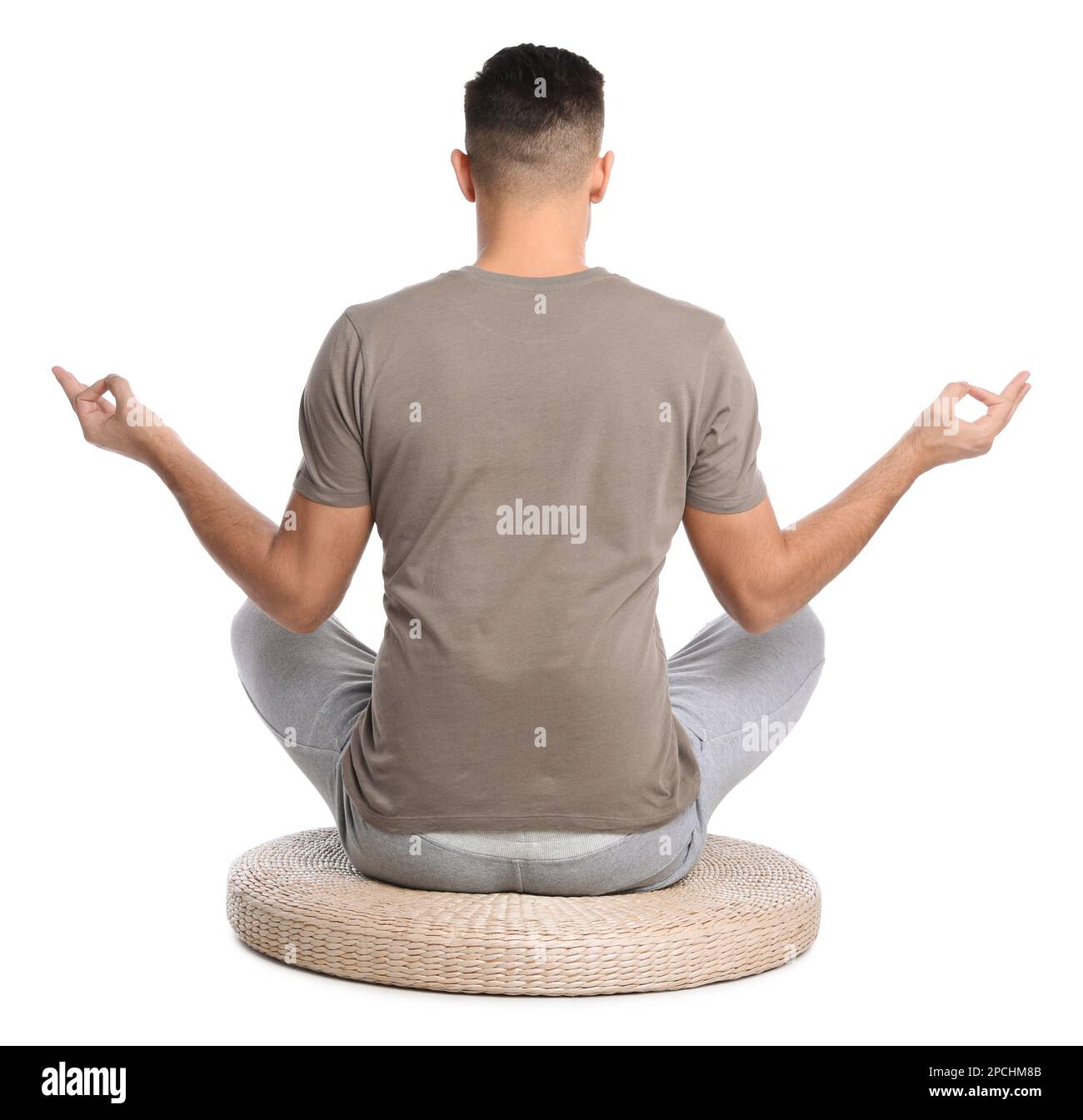 Man meditating on white background, back view Stock Photo - Alamy