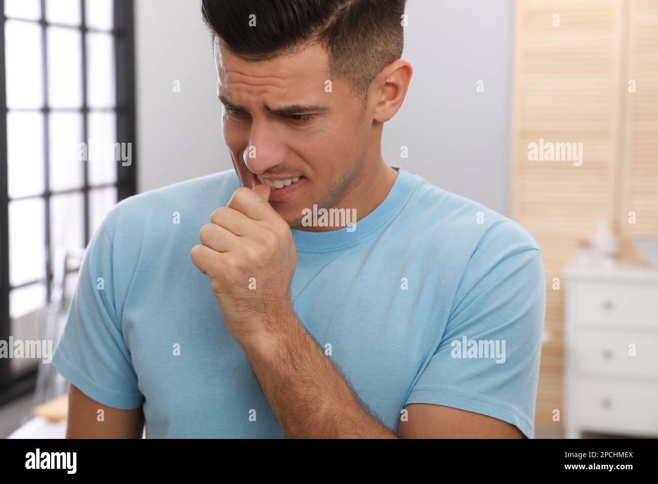 Biting her nails hi-res stock photography and images - Alamy