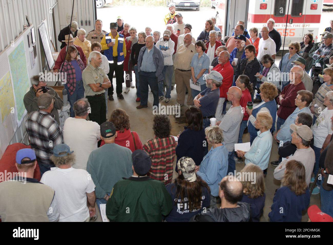 Gunflint District Ranger Dennis D. Neitzke, left with arms crossed ...