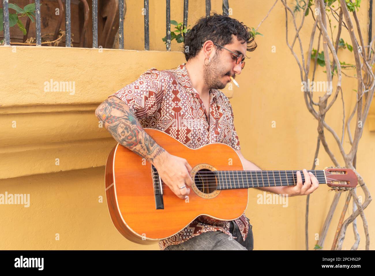 Playing guitar while smoking hi-res stock photography and images - Alamy