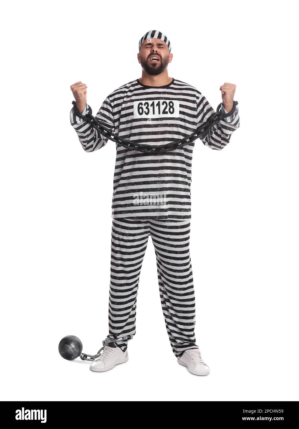 Prisoner in special uniform with chained hands and metal ball on white ...