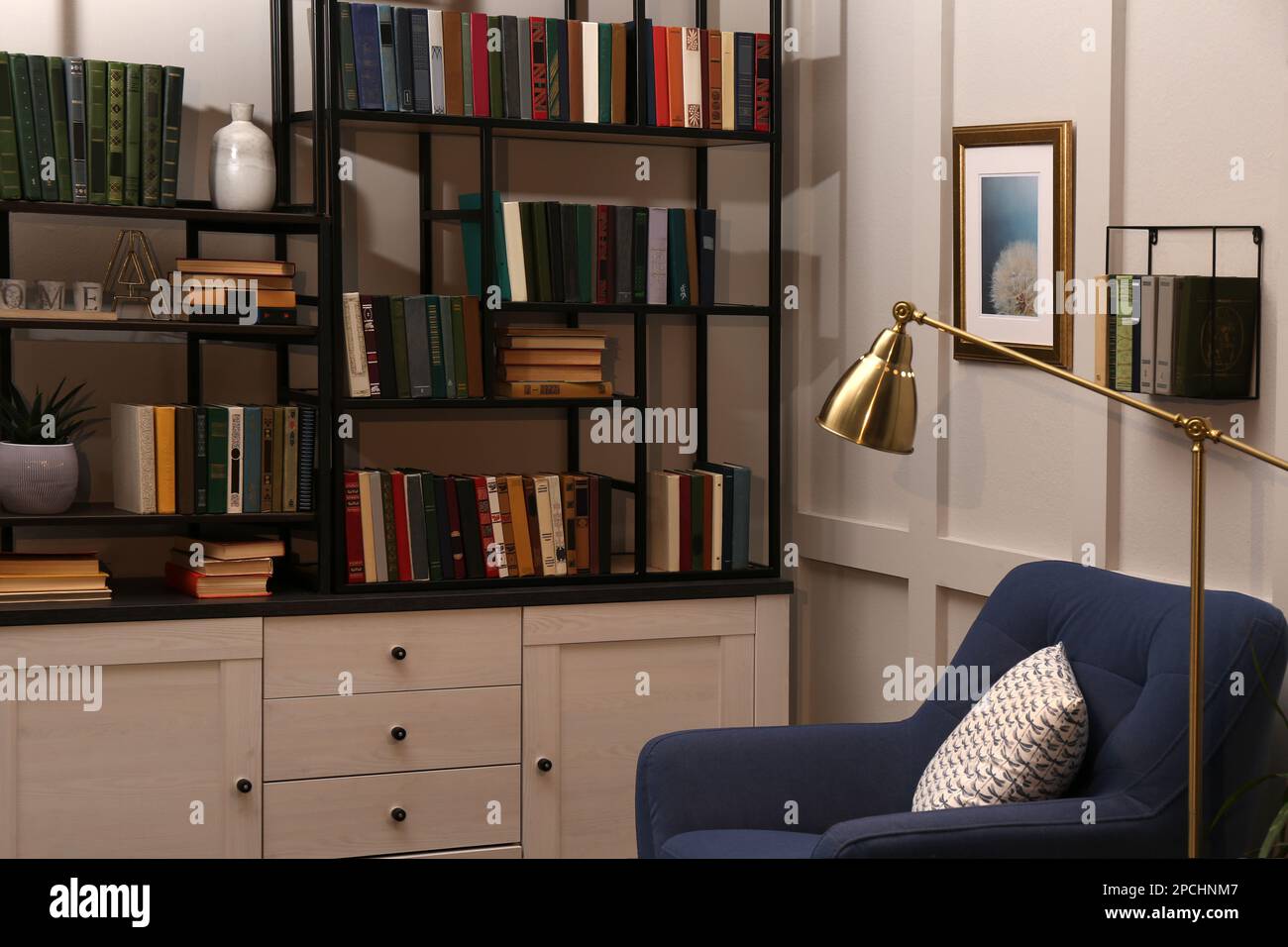 Cozy home library interior with collection of different books on ...