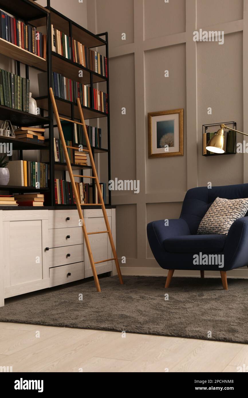 Cozy home library interior with collection of different books on ...