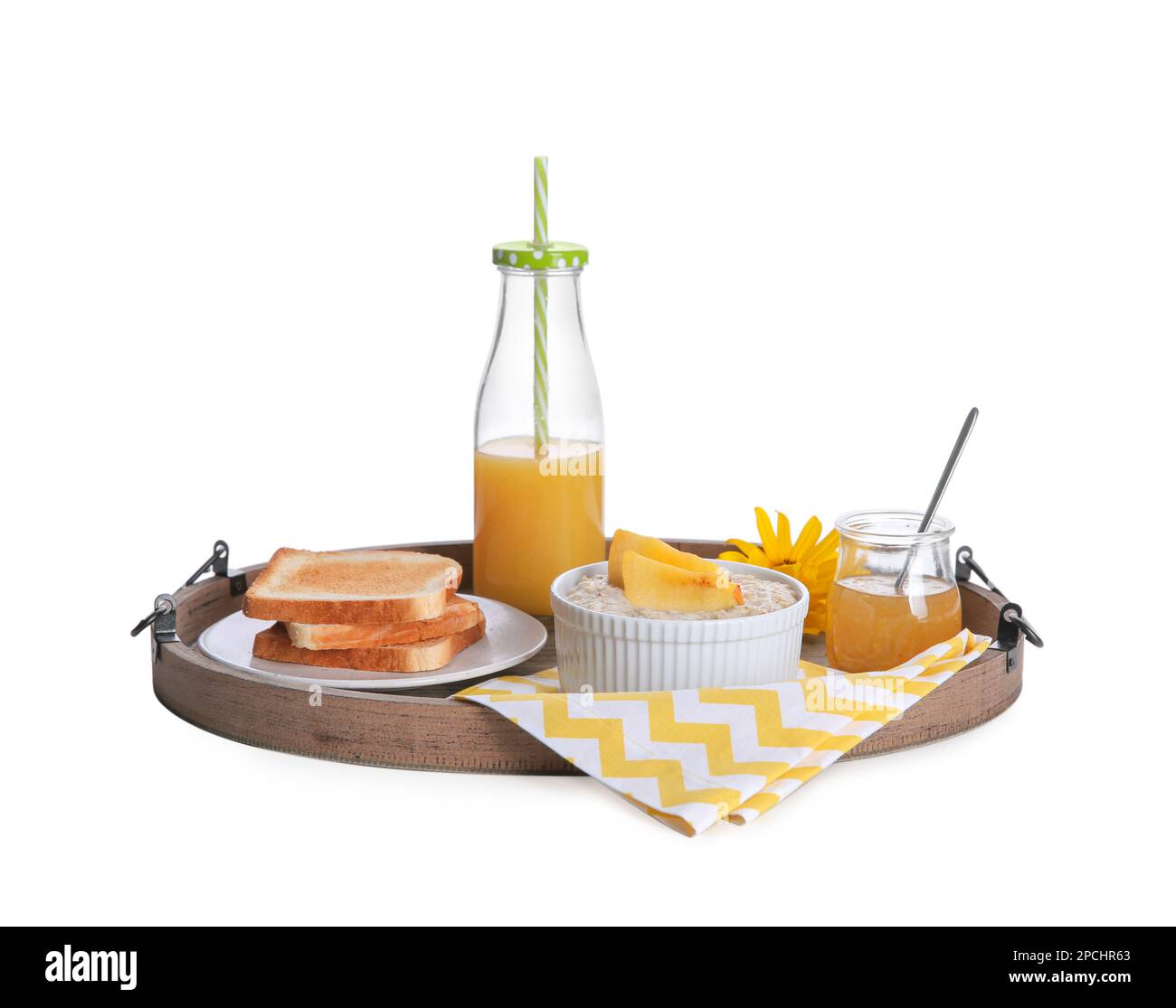 Wooden tray with delicious breakfast and beautiful flower on white ...