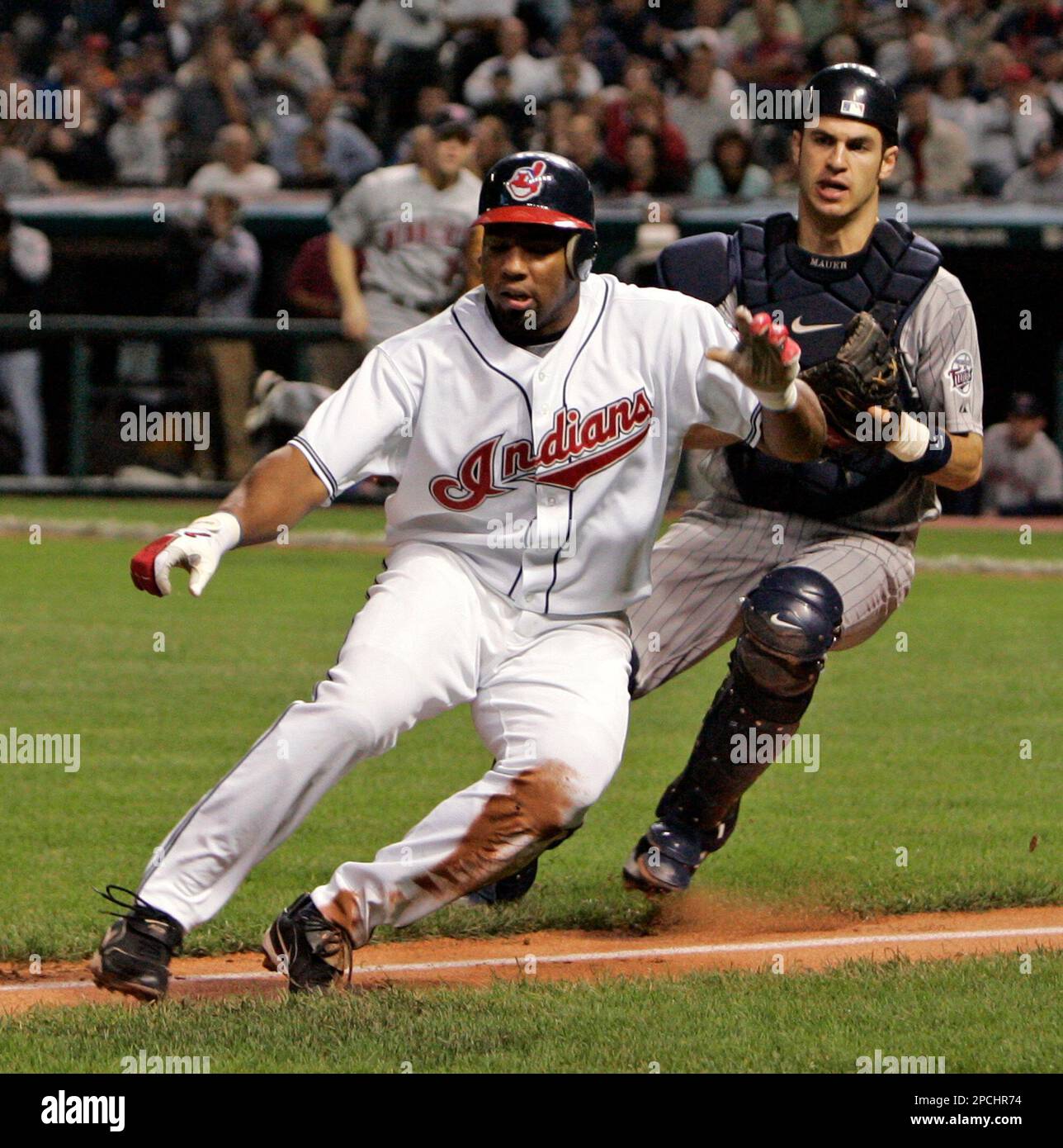 Cleveland Indians' Hector Luna, left, is caught in a rundown between ...