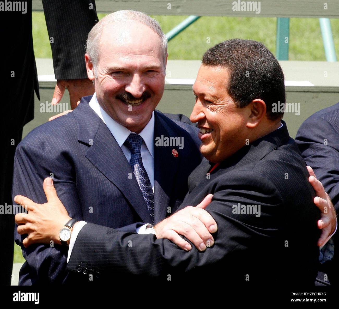Venezuela's President Hugo Chavez, right, embraces Belarus' President ...