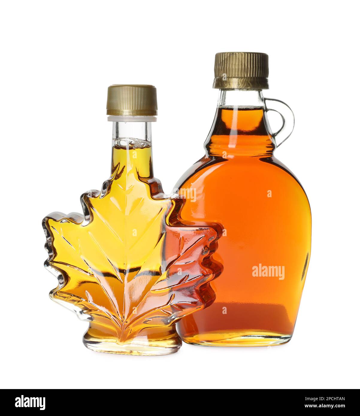 Different bottles of tasty maple syrup on white background Stock Photo ...