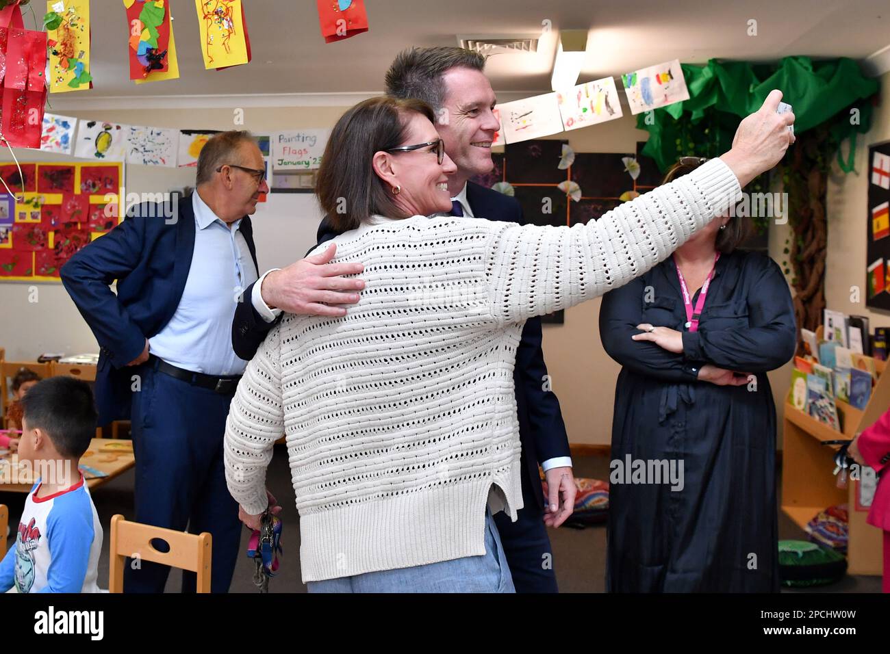 NSW Labor leader Chris Minns (right) poses for a selfie with staff at ...