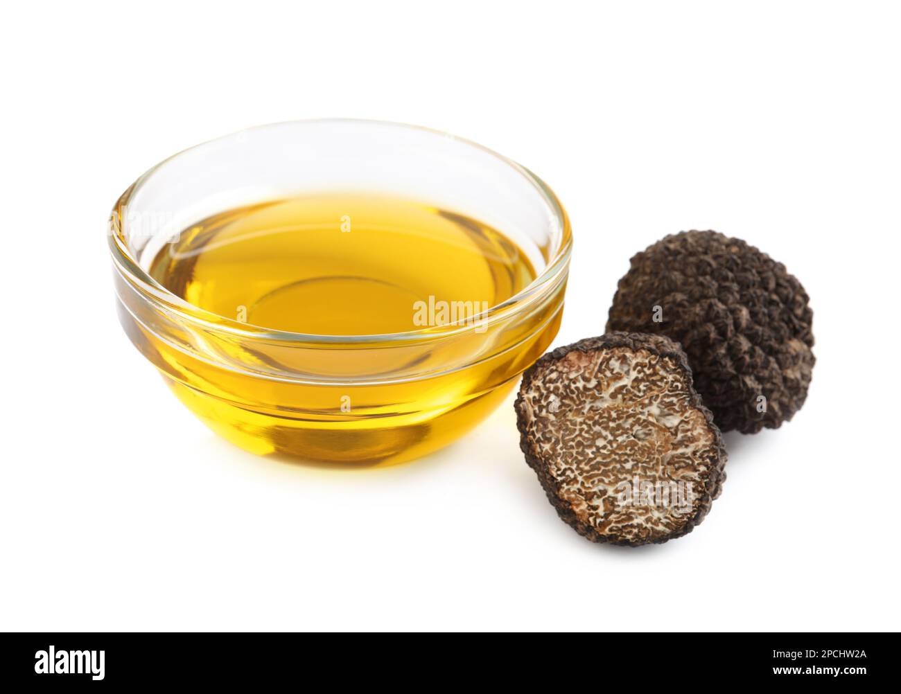 Glass bowl of oil and fresh truffles on white background Stock Photo ...