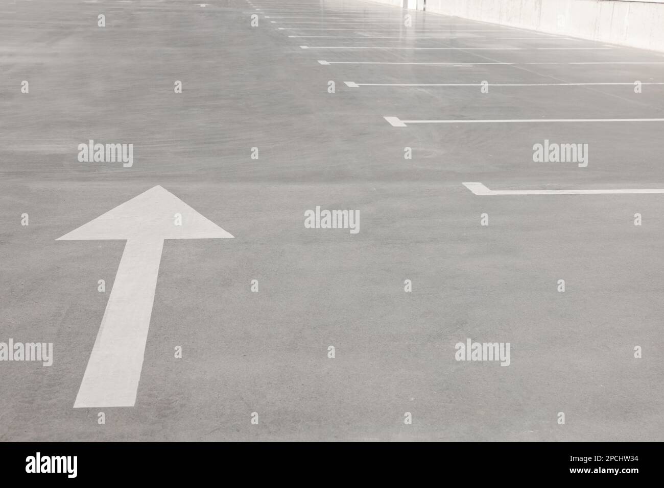 Outdoor car parking lot with arrow on sunny day Stock Photo - Alamy