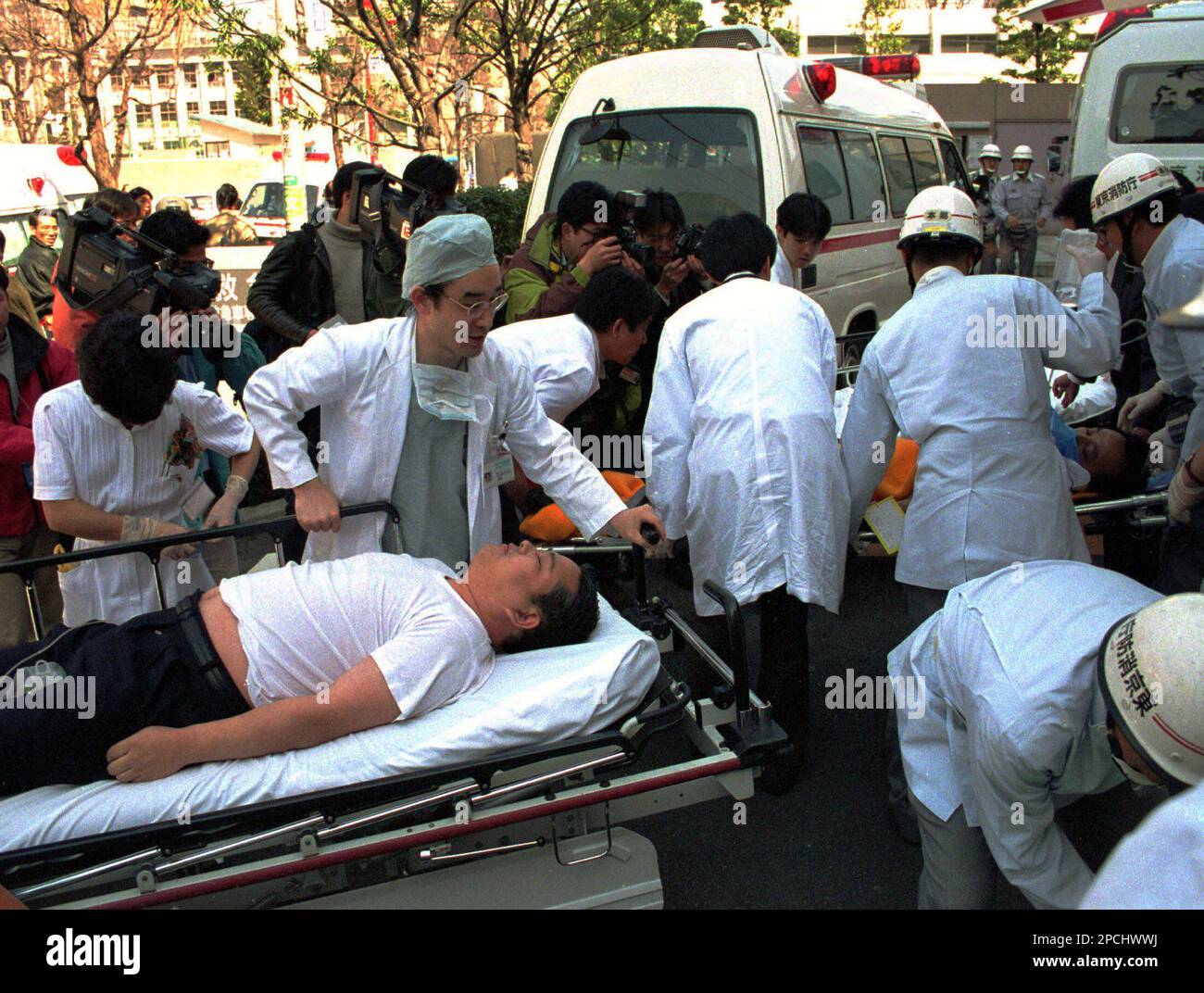 ** FILE ** Subway passengers are taken on stretchers from ambulances ...