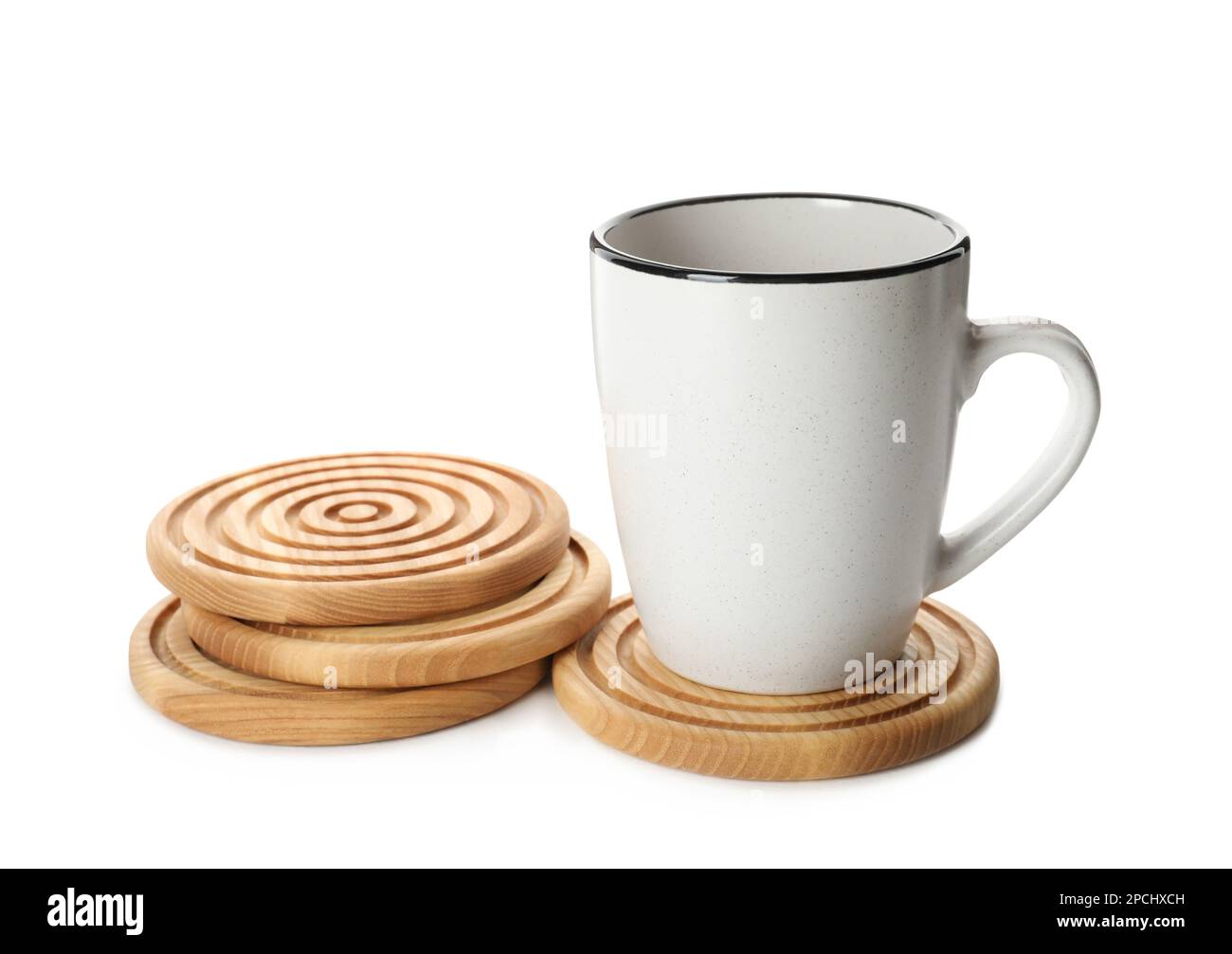 Mug and stylish wooden coasters on white background Stock Photo - Alamy