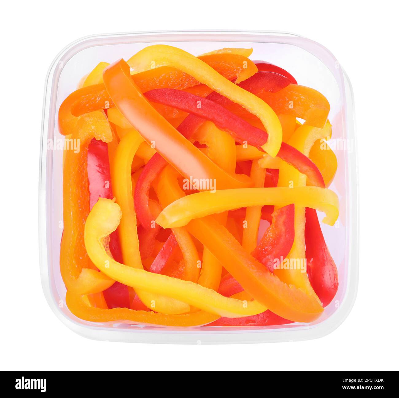 Fresh cut bell peppers in plastic container isolated on white, top view ...