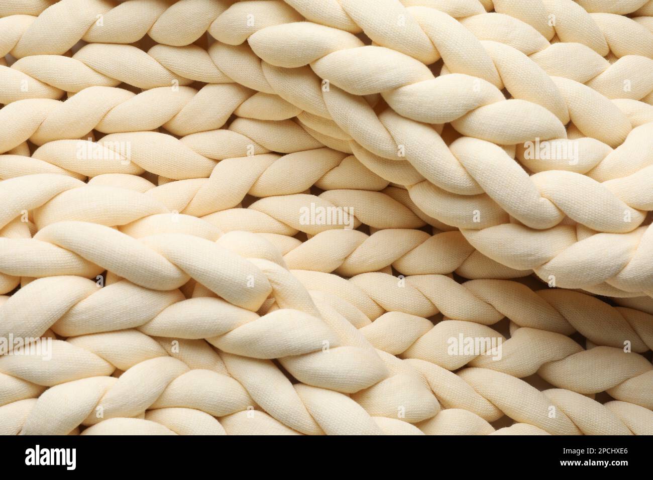 Chunky knit blankets as background, top view Stock Photo - Alamy