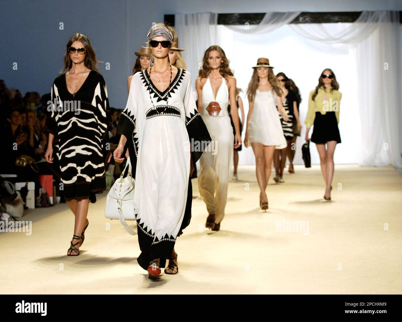 Models walk the runway for the finale, wearing fashion from the ...