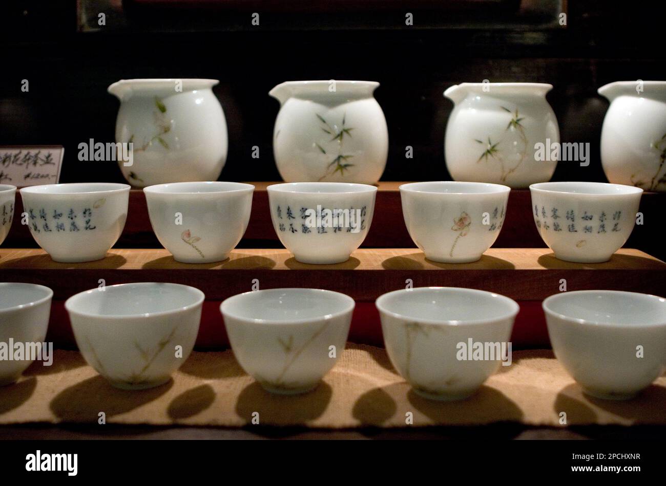 Traditional porcelain tea cups decorate the shelves of Yeh Tang Tea ...