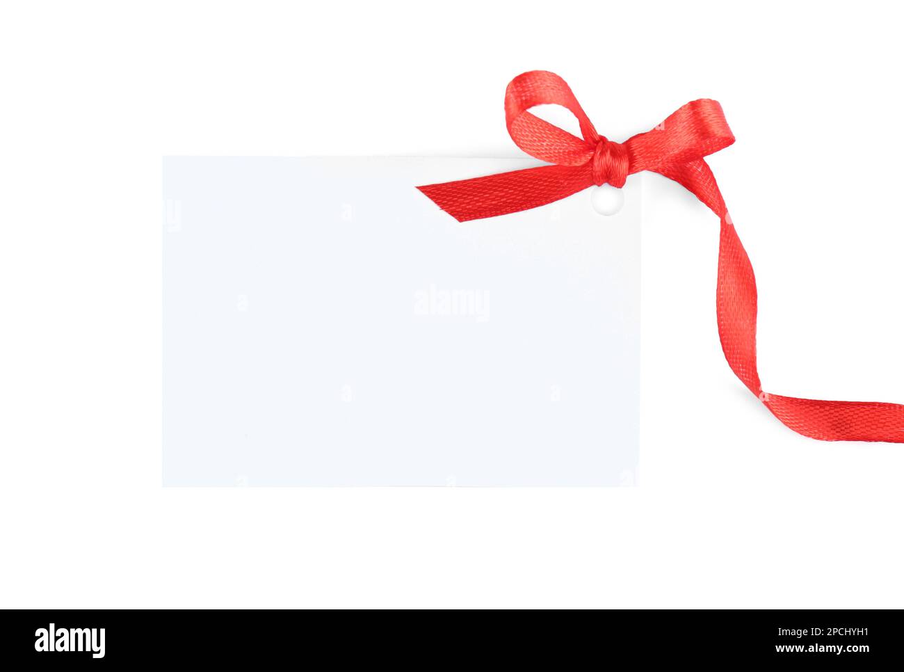 Blank gift tag with red satin ribbon on white background, top view ...