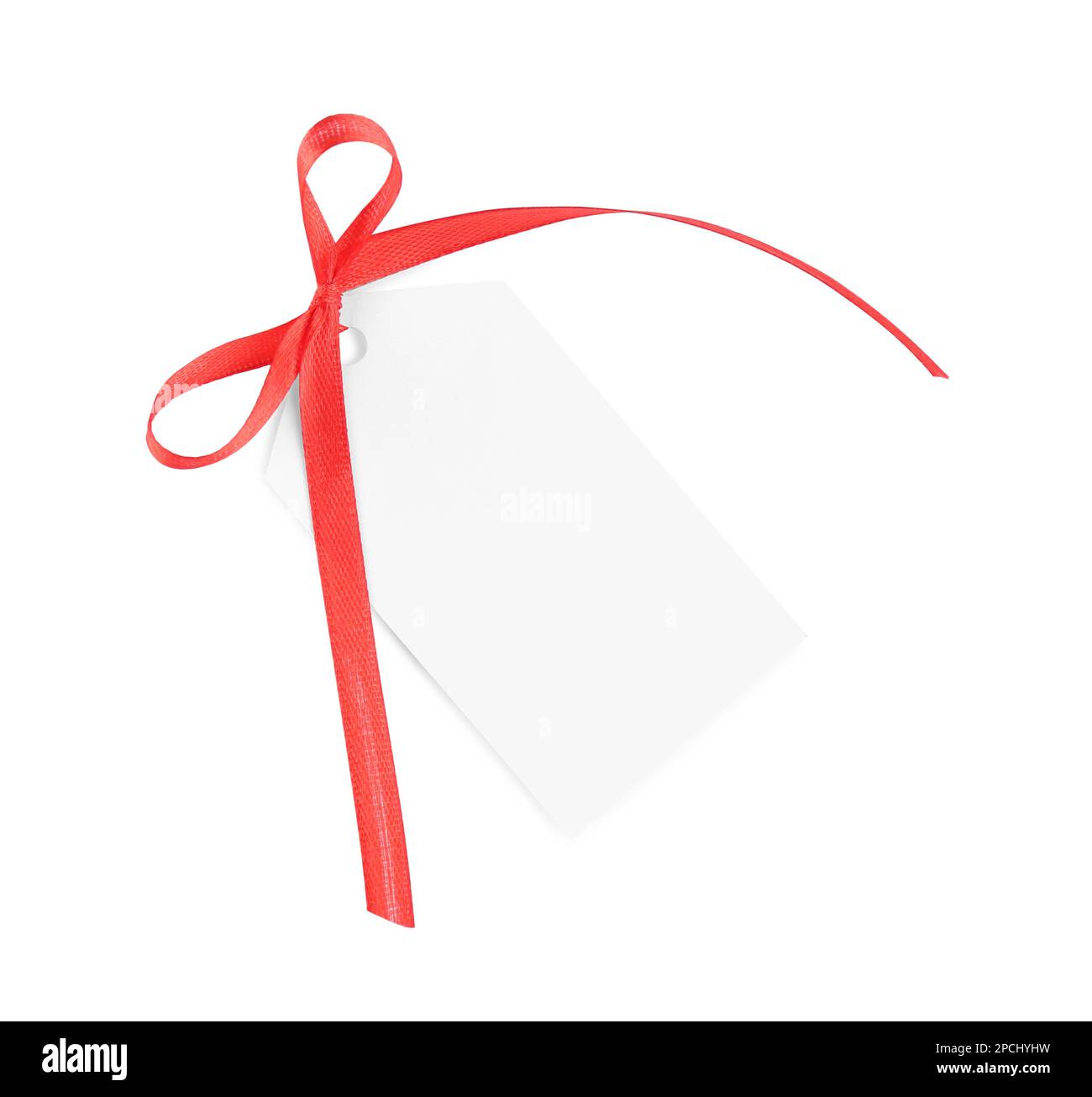 Blank gift tag with red satin ribbon on white background, top view ...