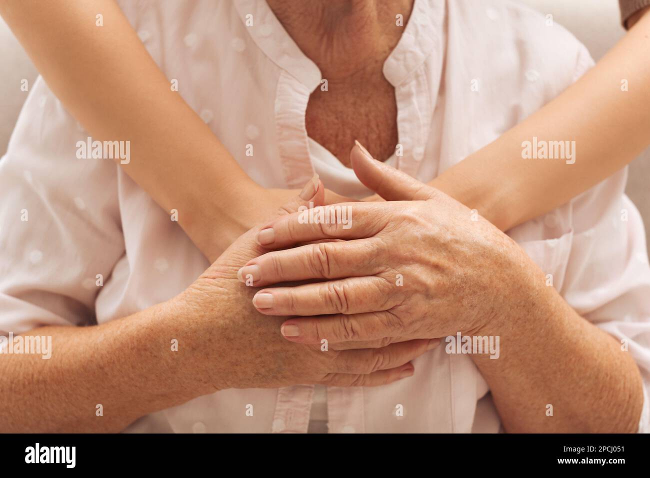 Old woman hugging young granddaughter hi-res stock photography and ...