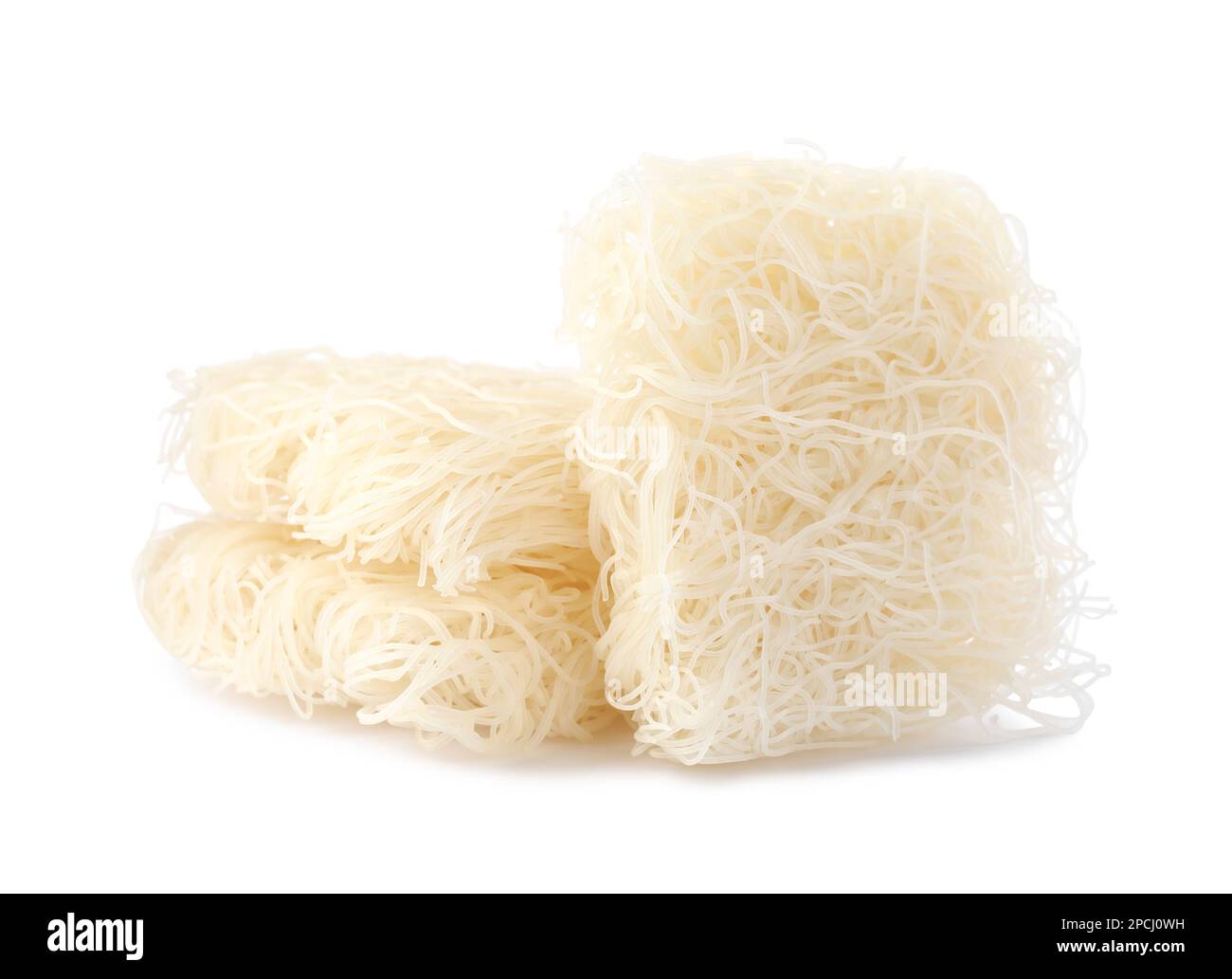 Bricks of dried rice noodles isolated on white. East Asian cuisine ...