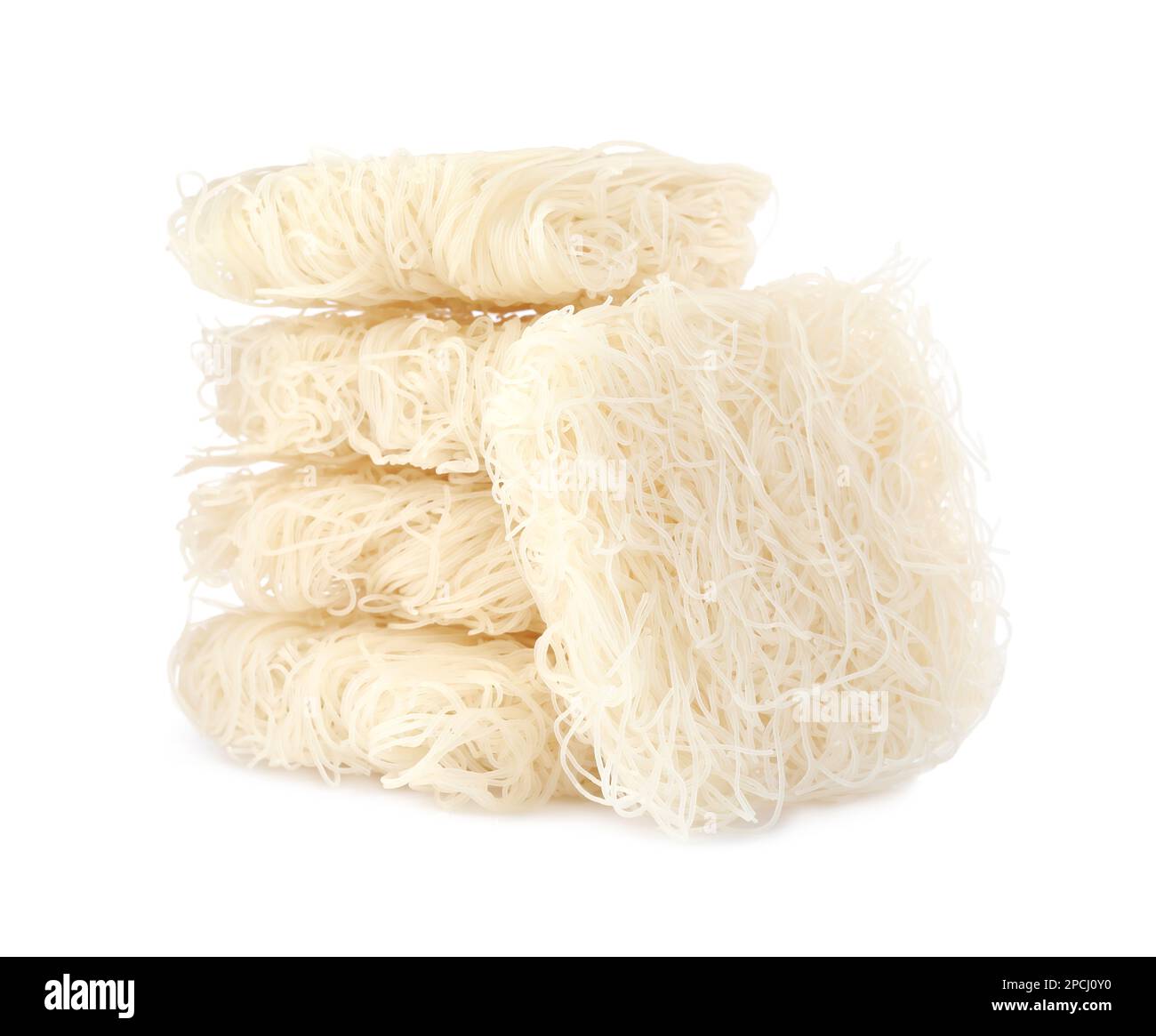 Bricks of dried rice noodles isolated on white. East Asian cuisine ...