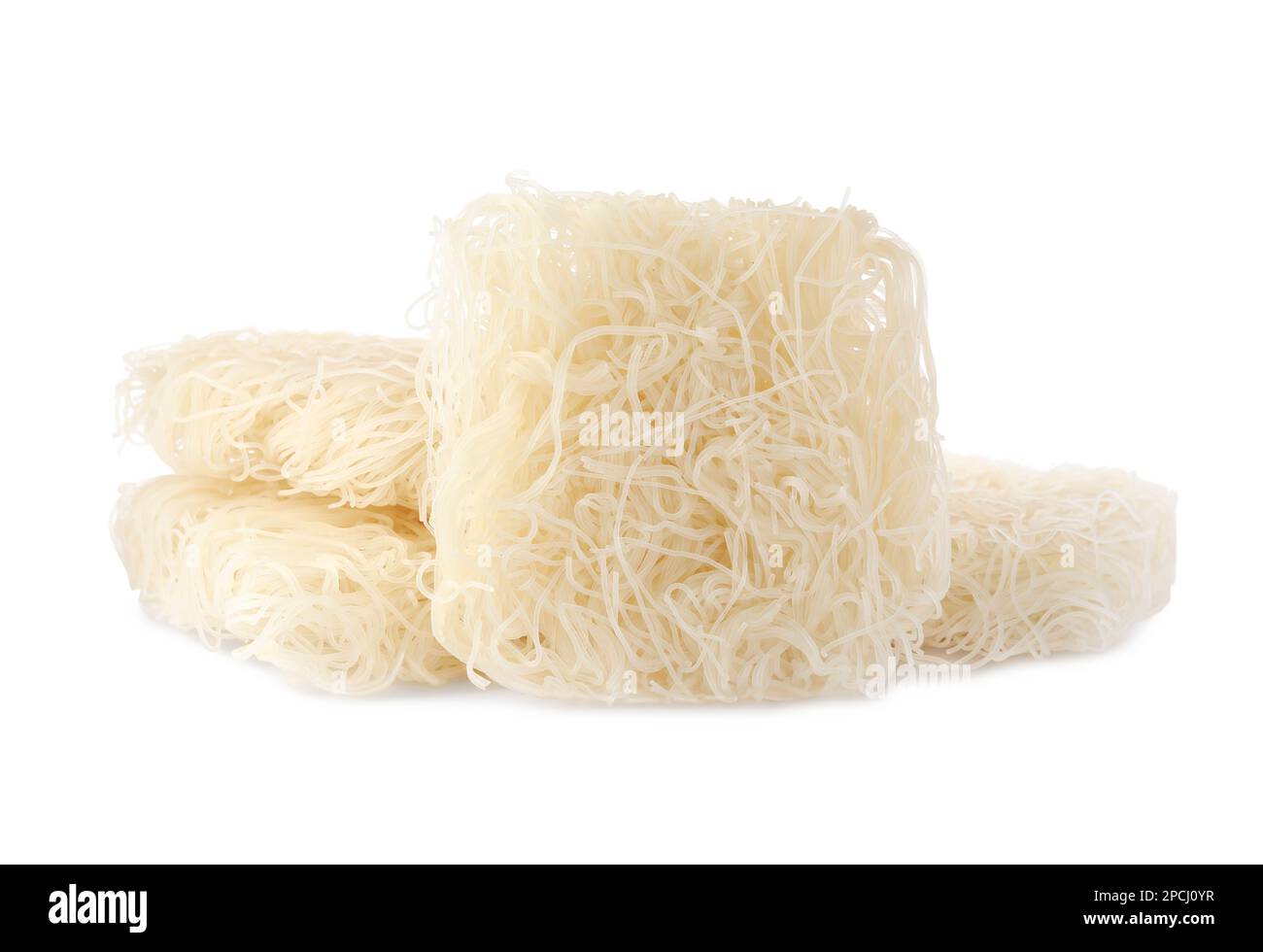 Bricks of dried rice noodles isolated on white. East Asian cuisine ...