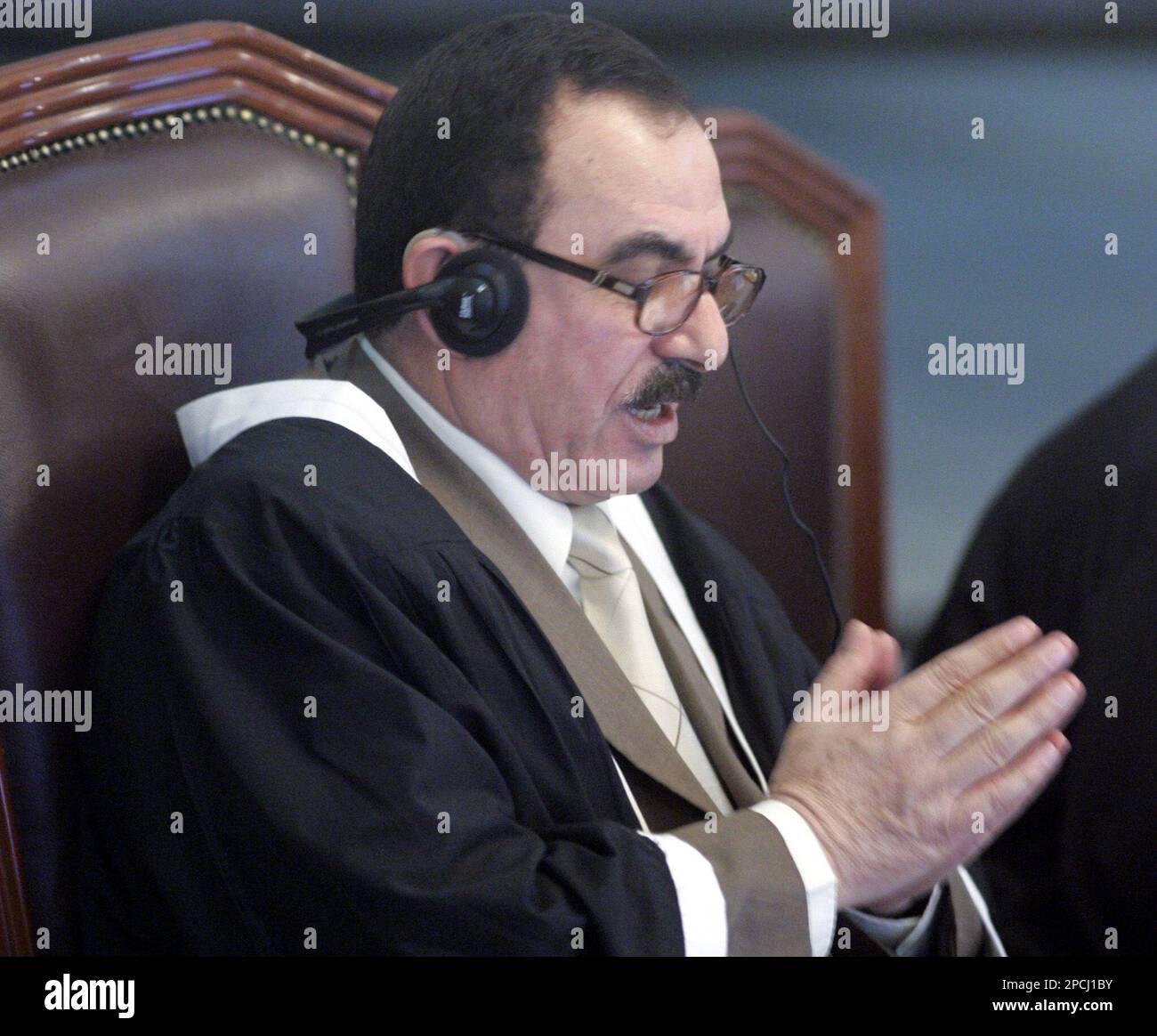 Chief judge Abdullah al-Amiri addresses the court during the trial of ...