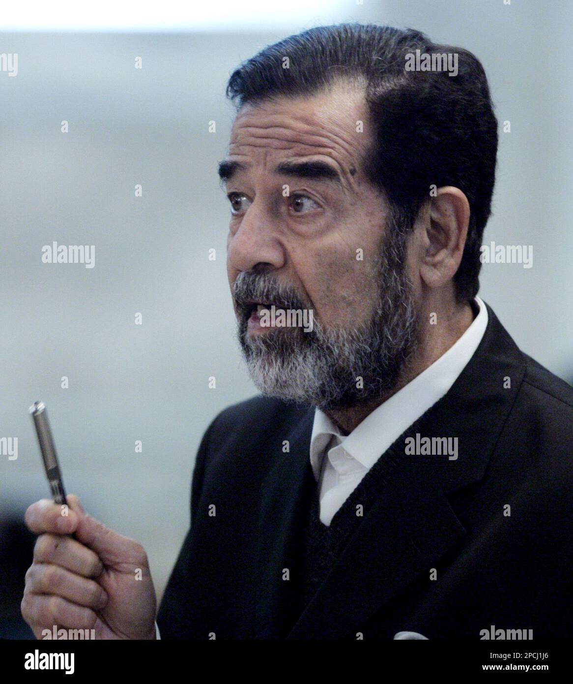 Former Iraqi President Saddam Hussein testifies during his trial on ...