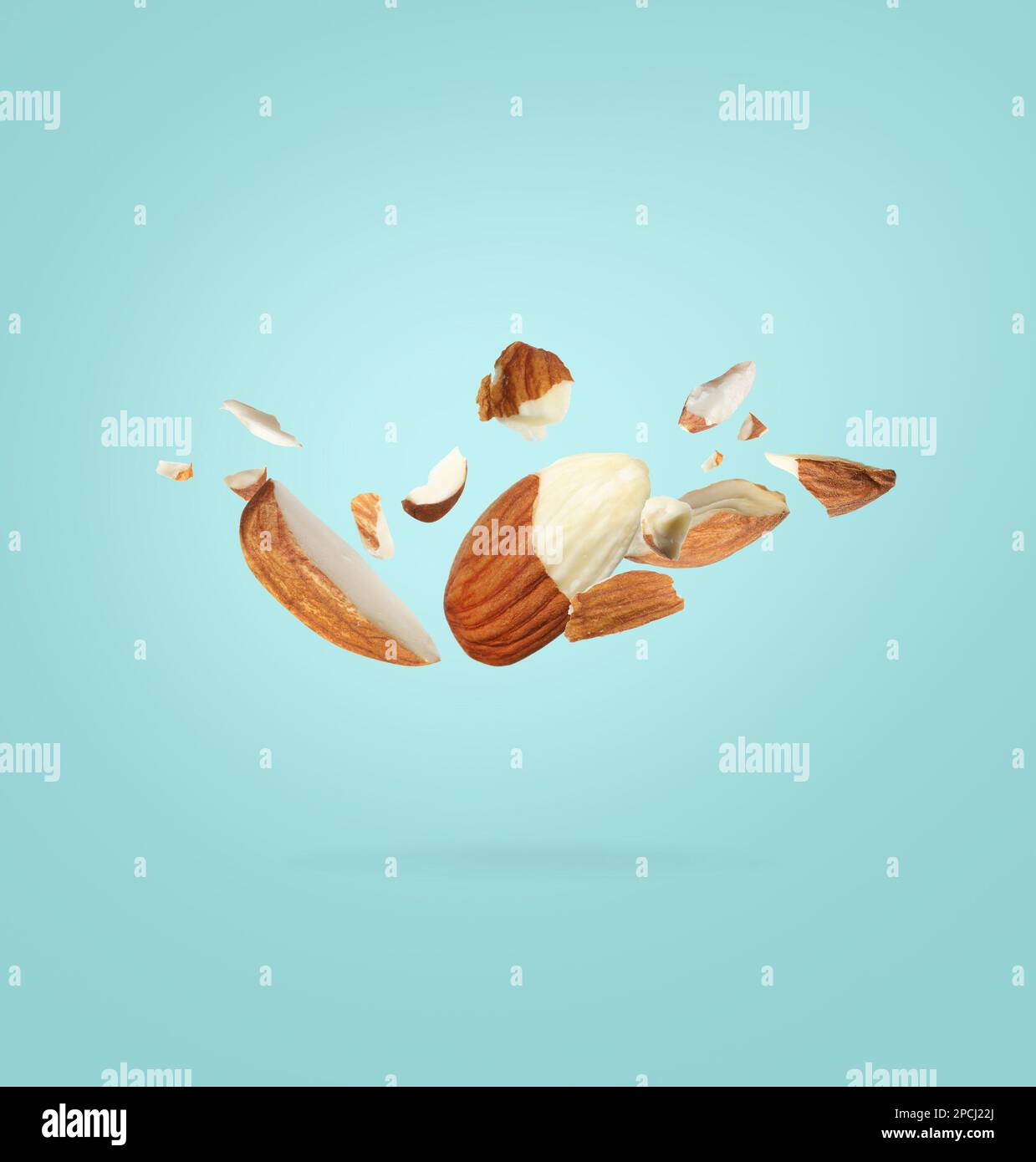 Flying many almonds nuts on hi-res stock photography and images - Alamy