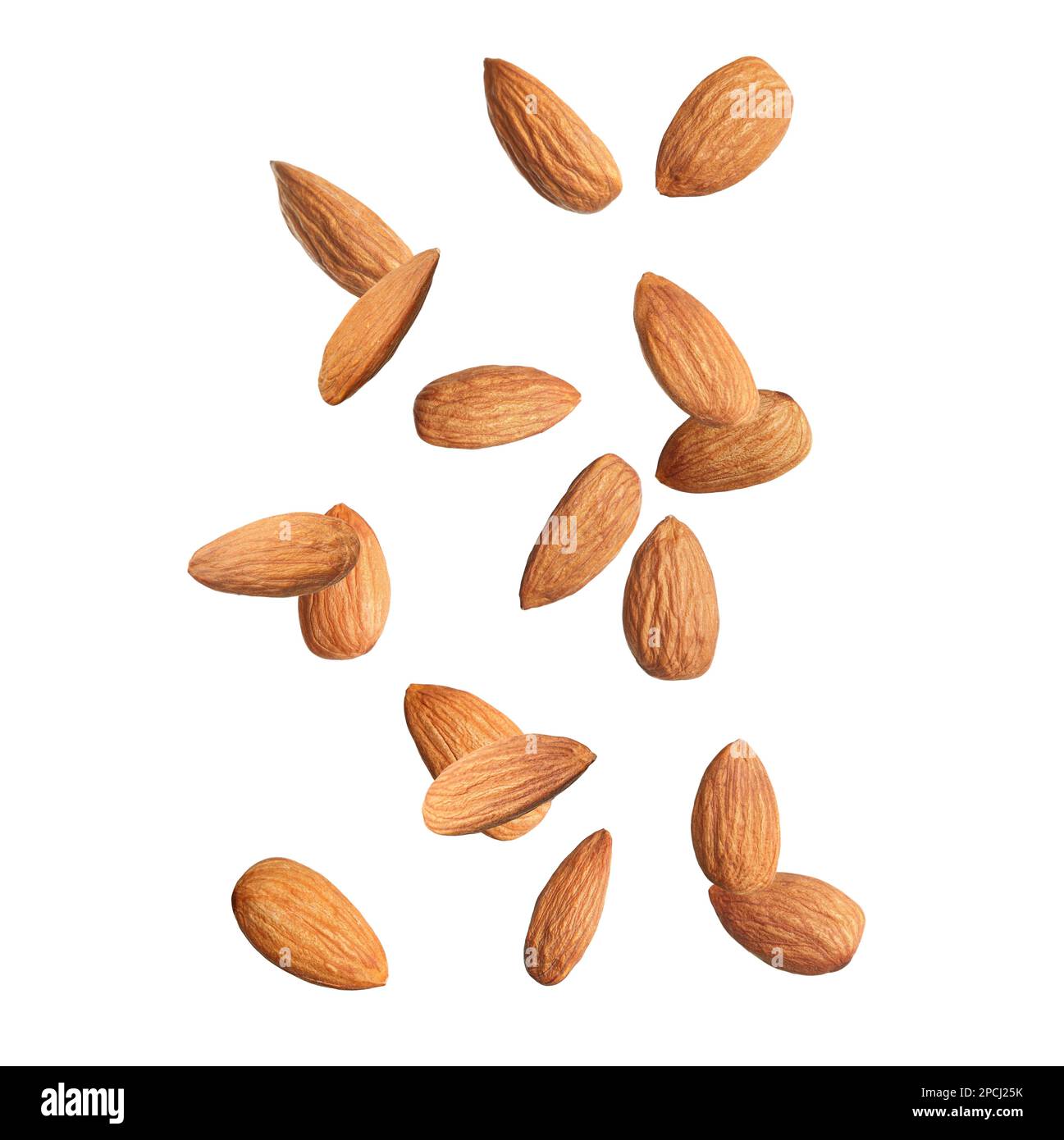 Many tasty almonds falling on white background Stock Photo - Alamy