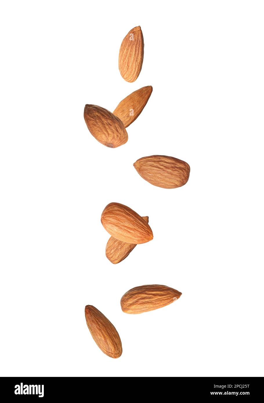 Many tasty almonds falling on white background Stock Photo - Alamy