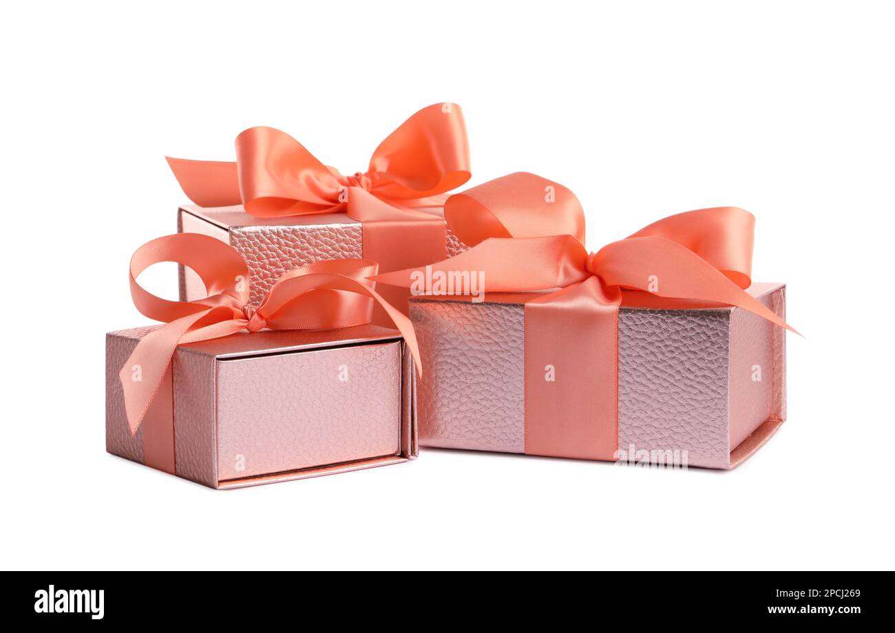 Three beautiful pink gift boxes on white background Stock Photo - Alamy