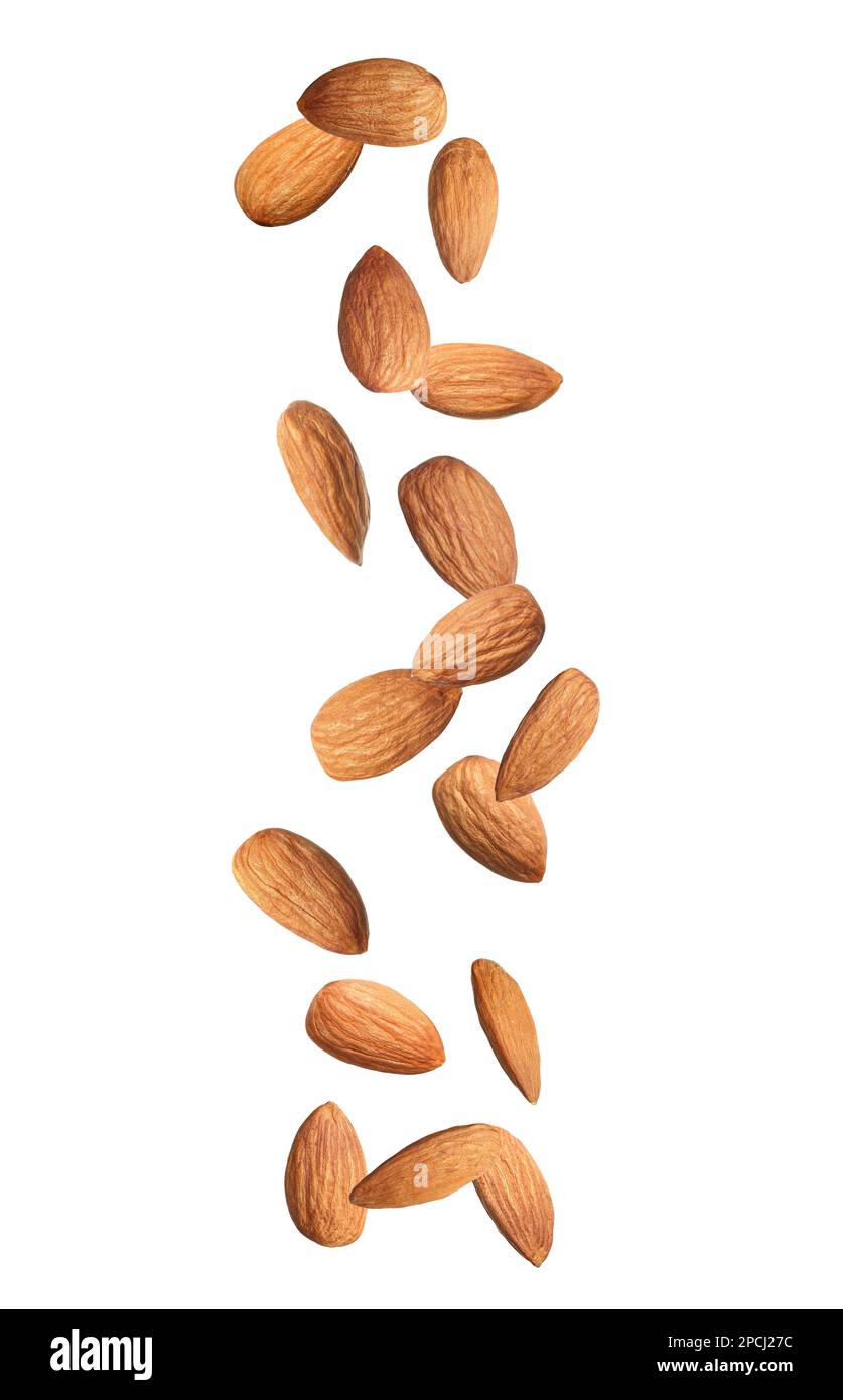 Many tasty almonds falling on white background Stock Photo - Alamy